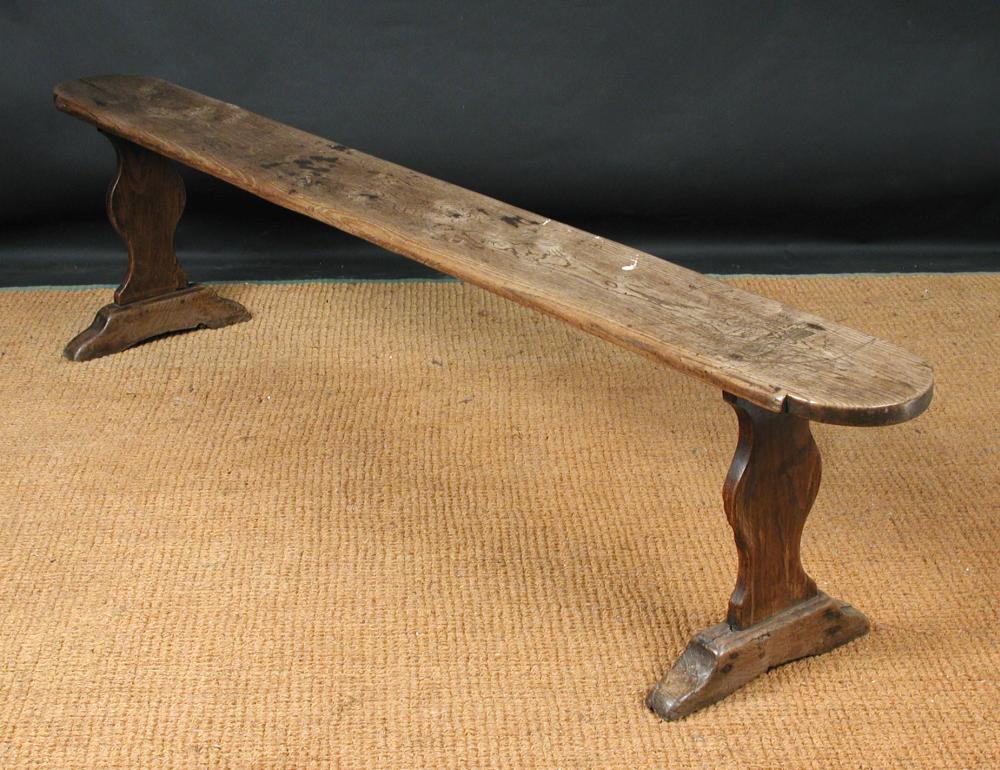 Lot 12 - An 18th century elm form,
