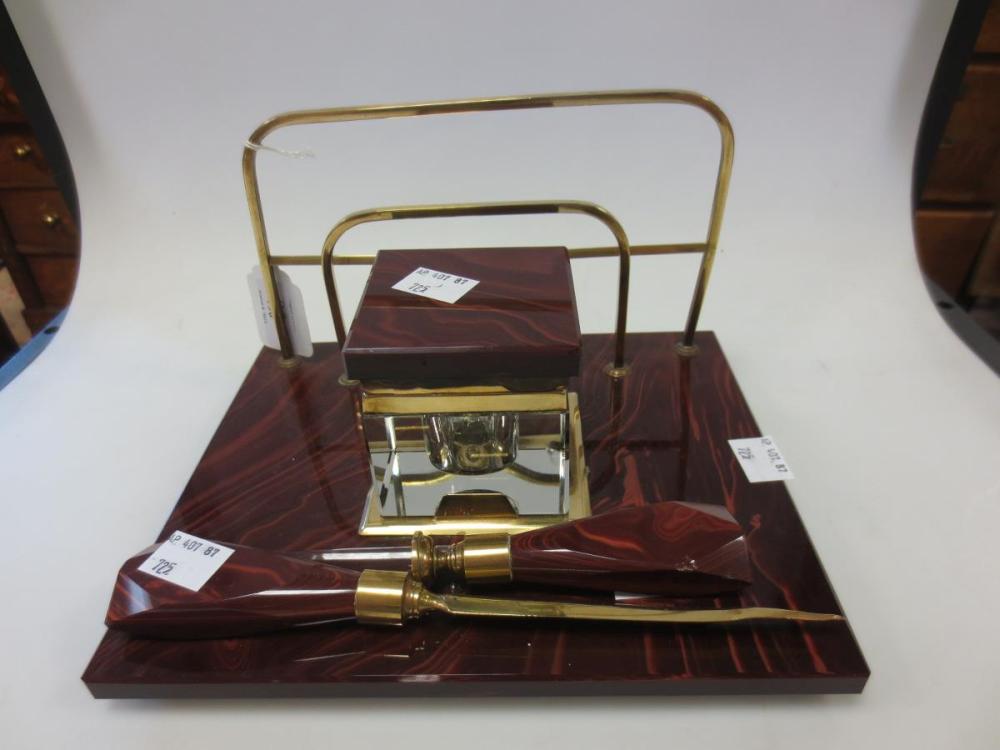 Lot 790 - A red marble desk set