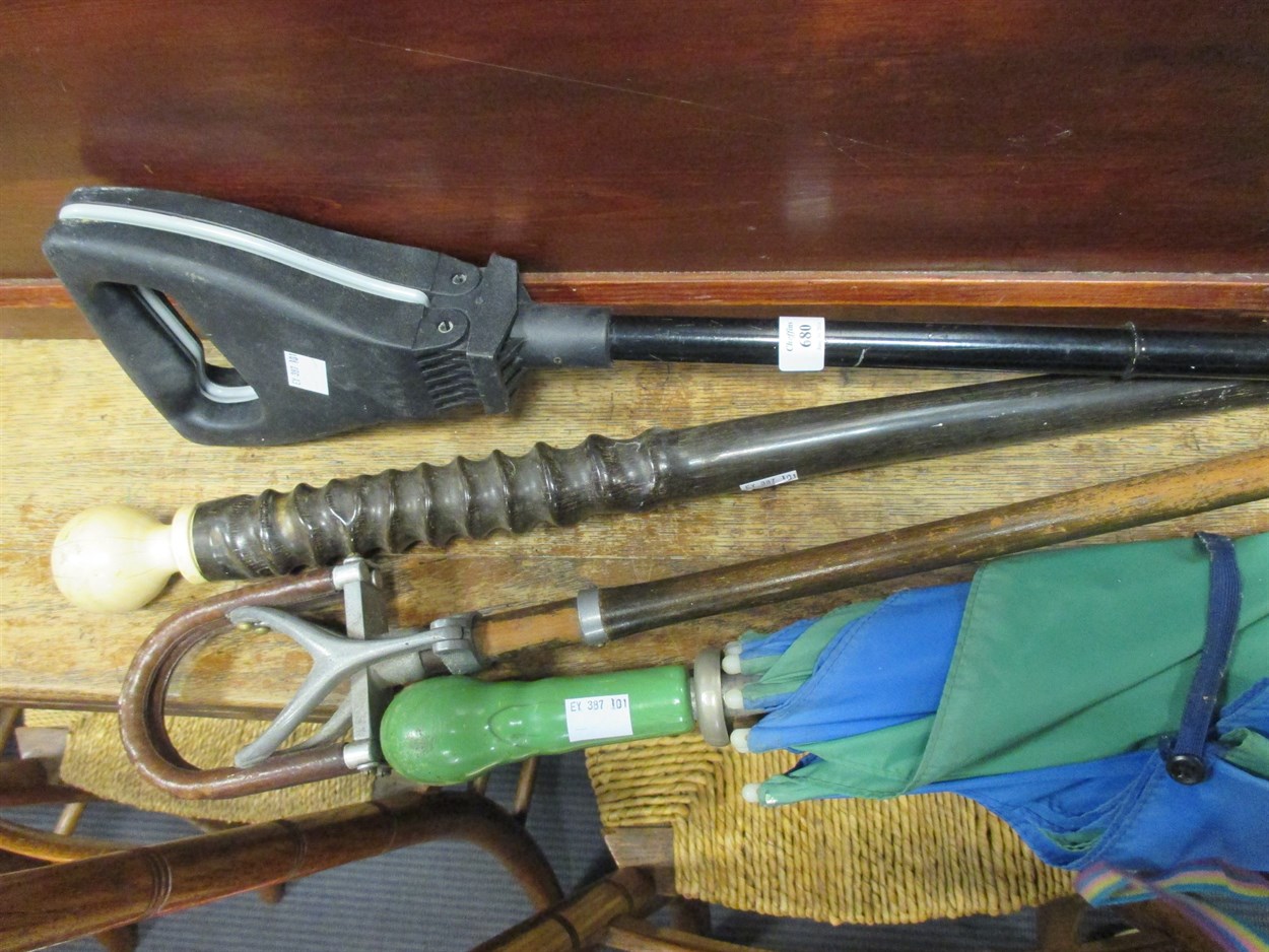 Lot 680 - An ivory topped walking cane, shooting