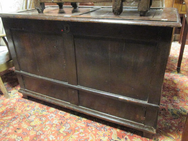Lot 658 - An 18th century oak coffer of plain design,