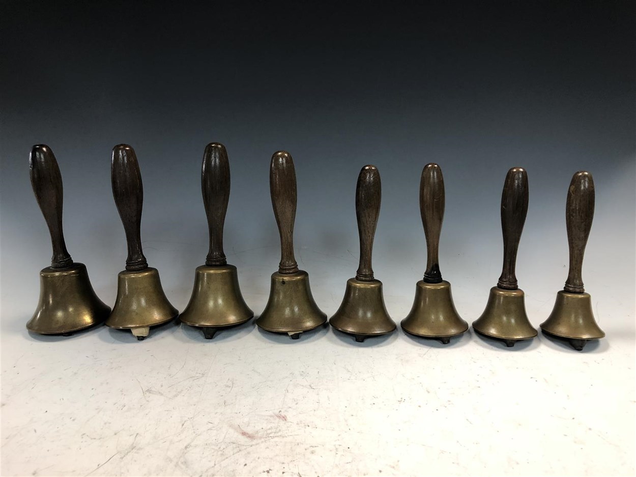 Lot 326 - A graduated set of eight handbells,