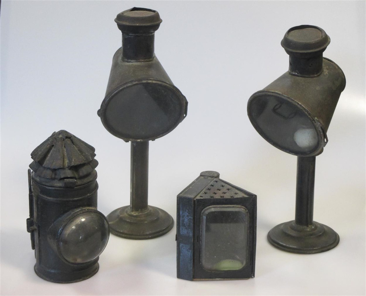 Lot 14 - A pair of candle lamps, a hand-held miner's