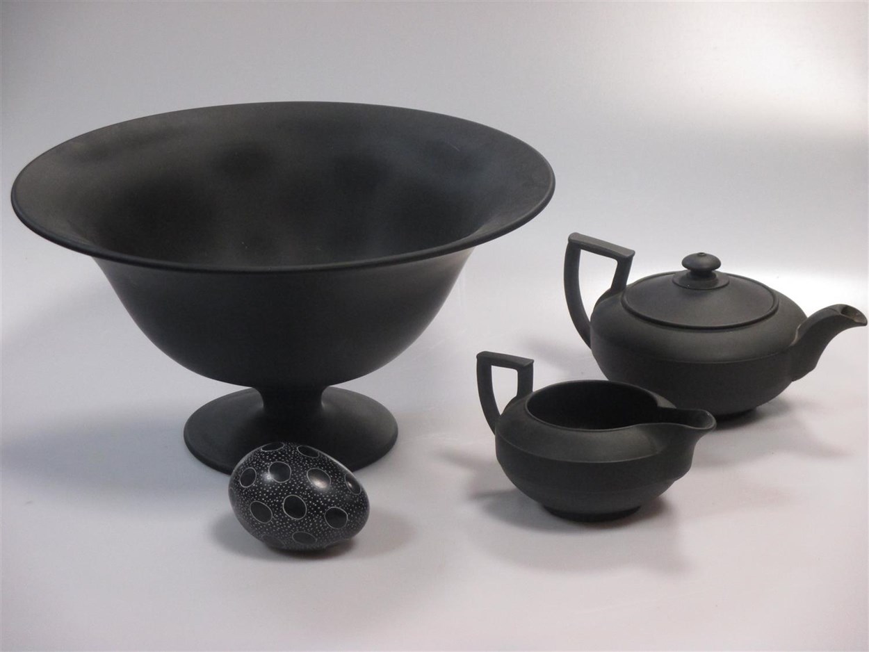 Lot 52 - A Wedgwood black basalt teapot and milk jug,