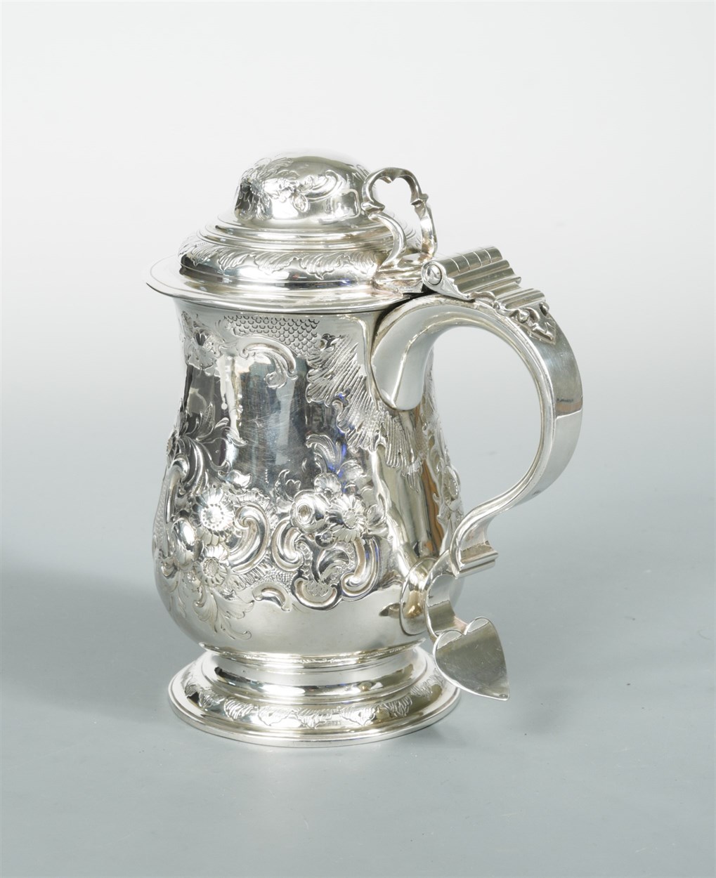 Lot 50 - A George III silver lidded tankard with later