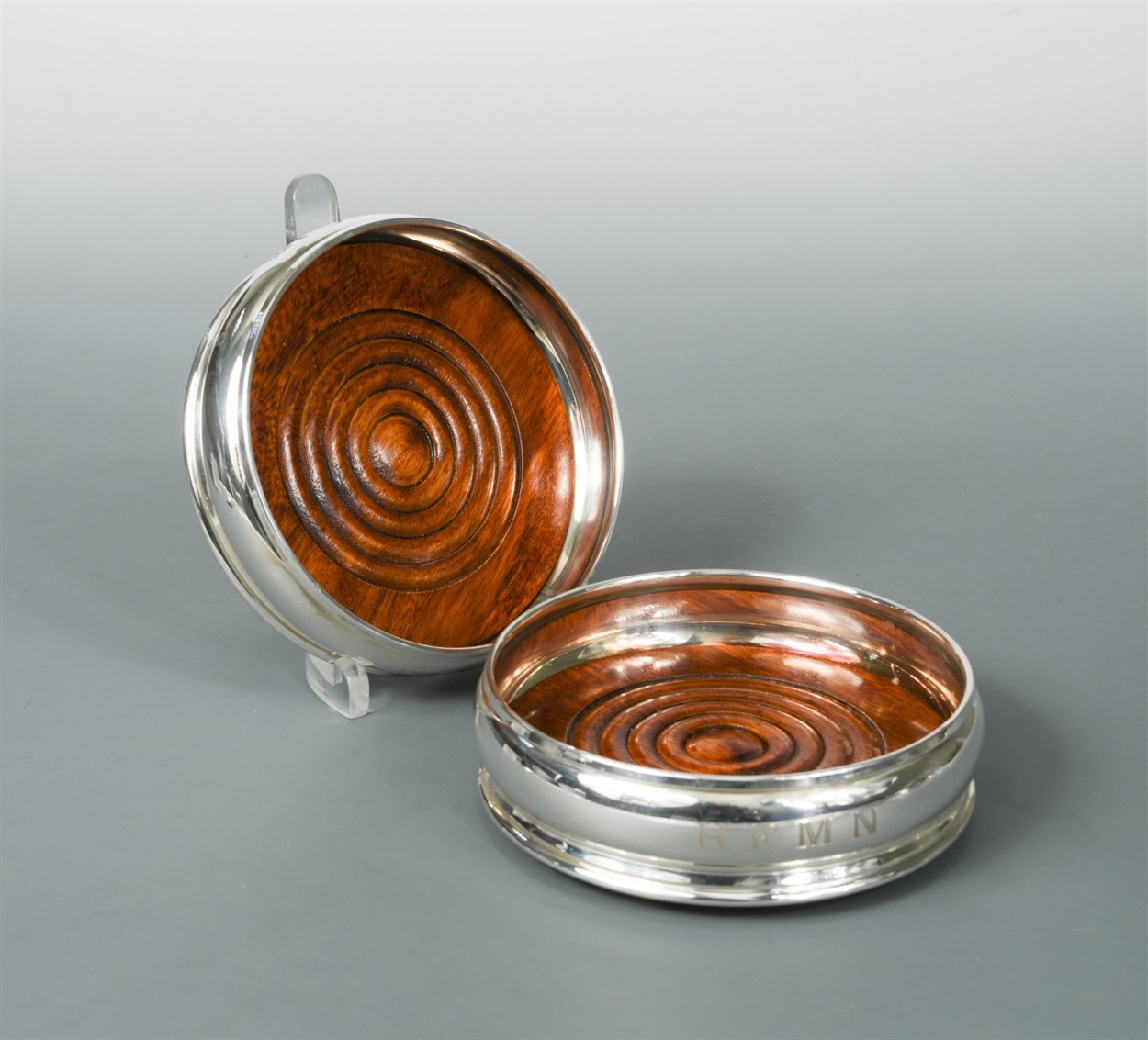 Lot 131 - A pair of modern silver bottle coasters,