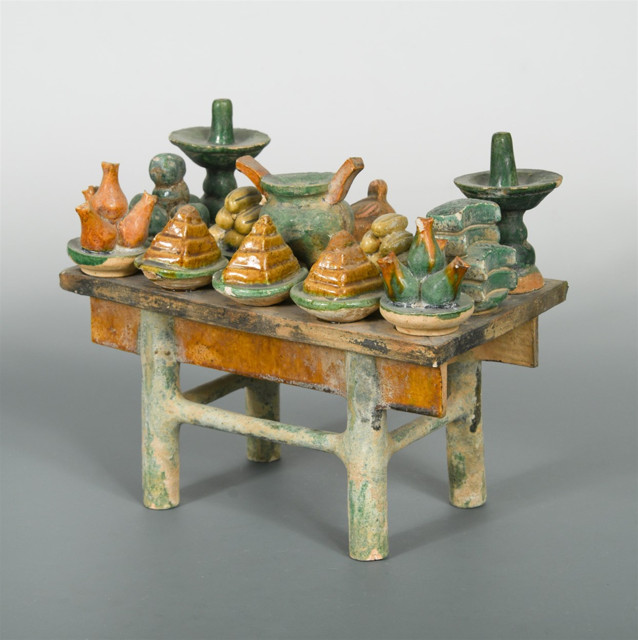 Lot 120 - A Ming dynasty sancai glazed offering table,