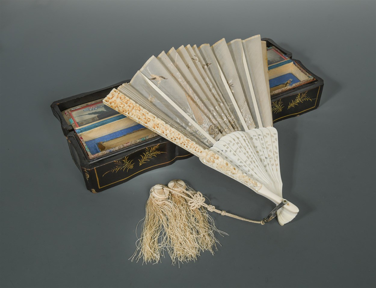 Lot 109 - A Chinese export carved, pierced ivory fan,