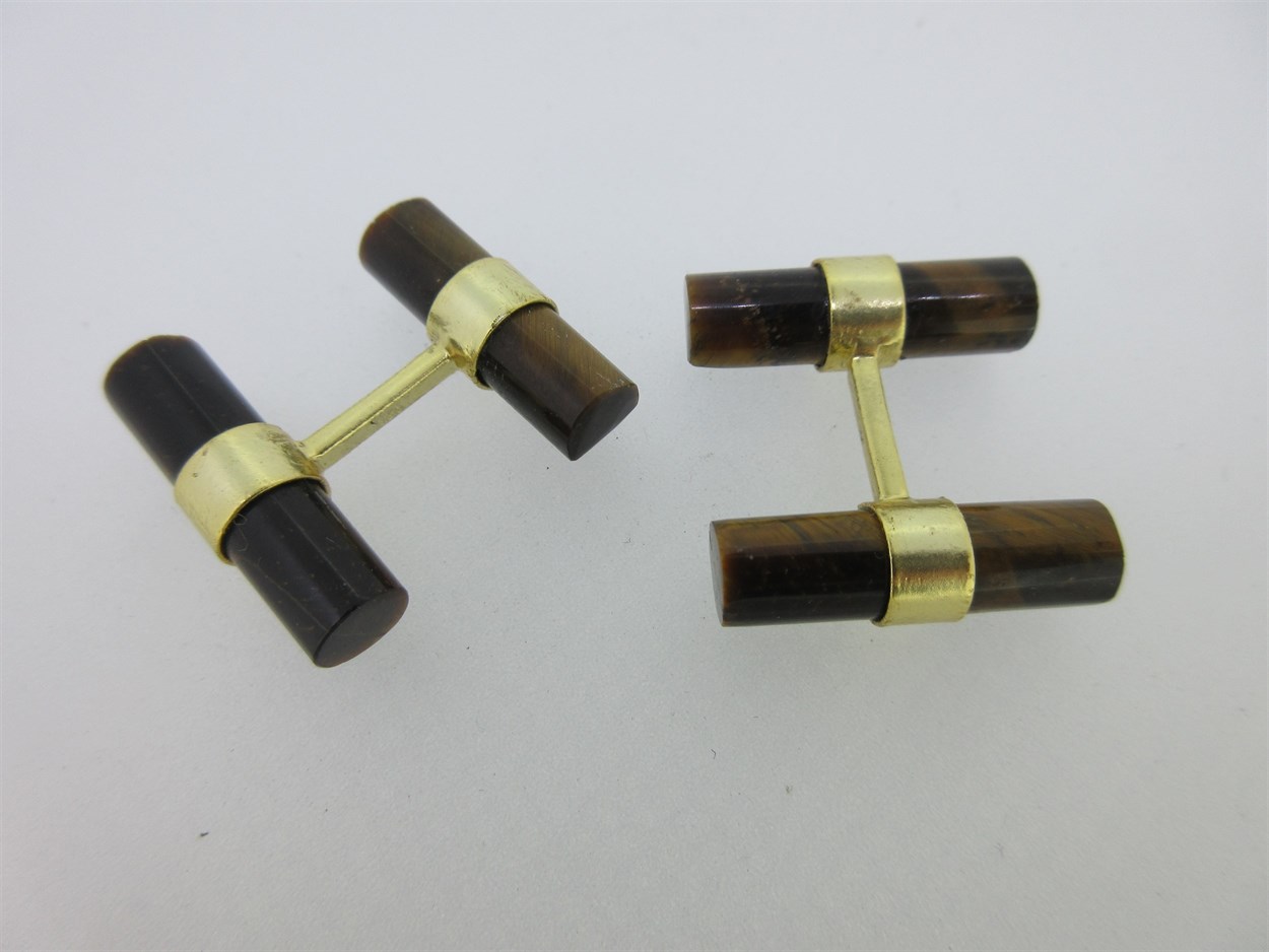 Lot 27 - A pair of tiger's eye baton double-ended