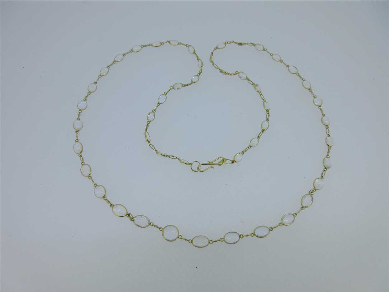 Lot 52 - A necklace of spectacle set moonstones,