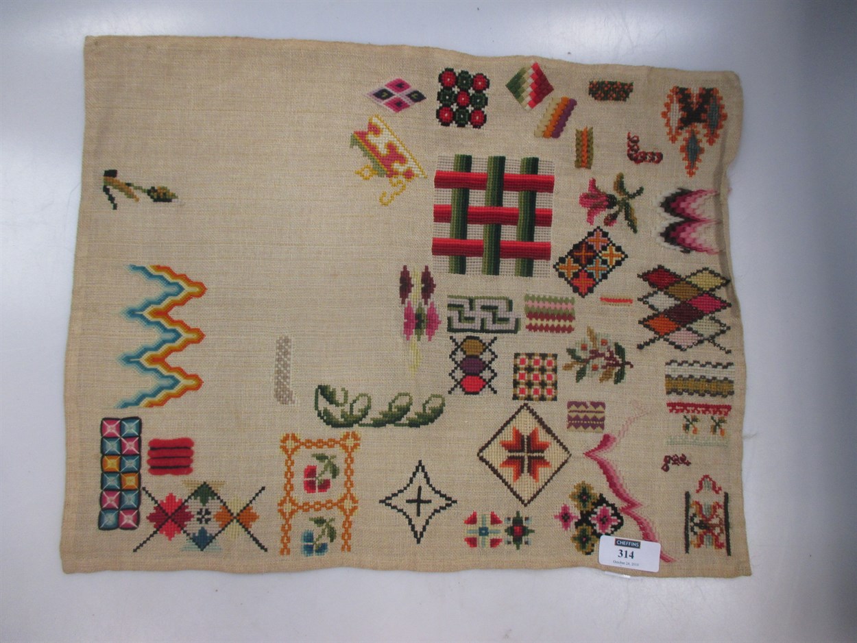 Lot 314 - Five 19th century needlework example panels,