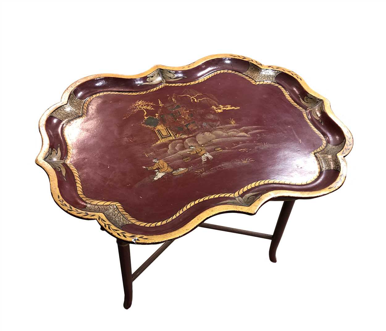 Lot 359 - A red lacquer tray on stand,