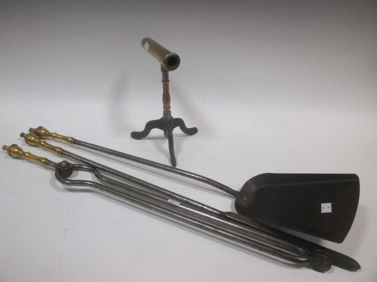Lot 700 - A set of Regency and brass fire irons
