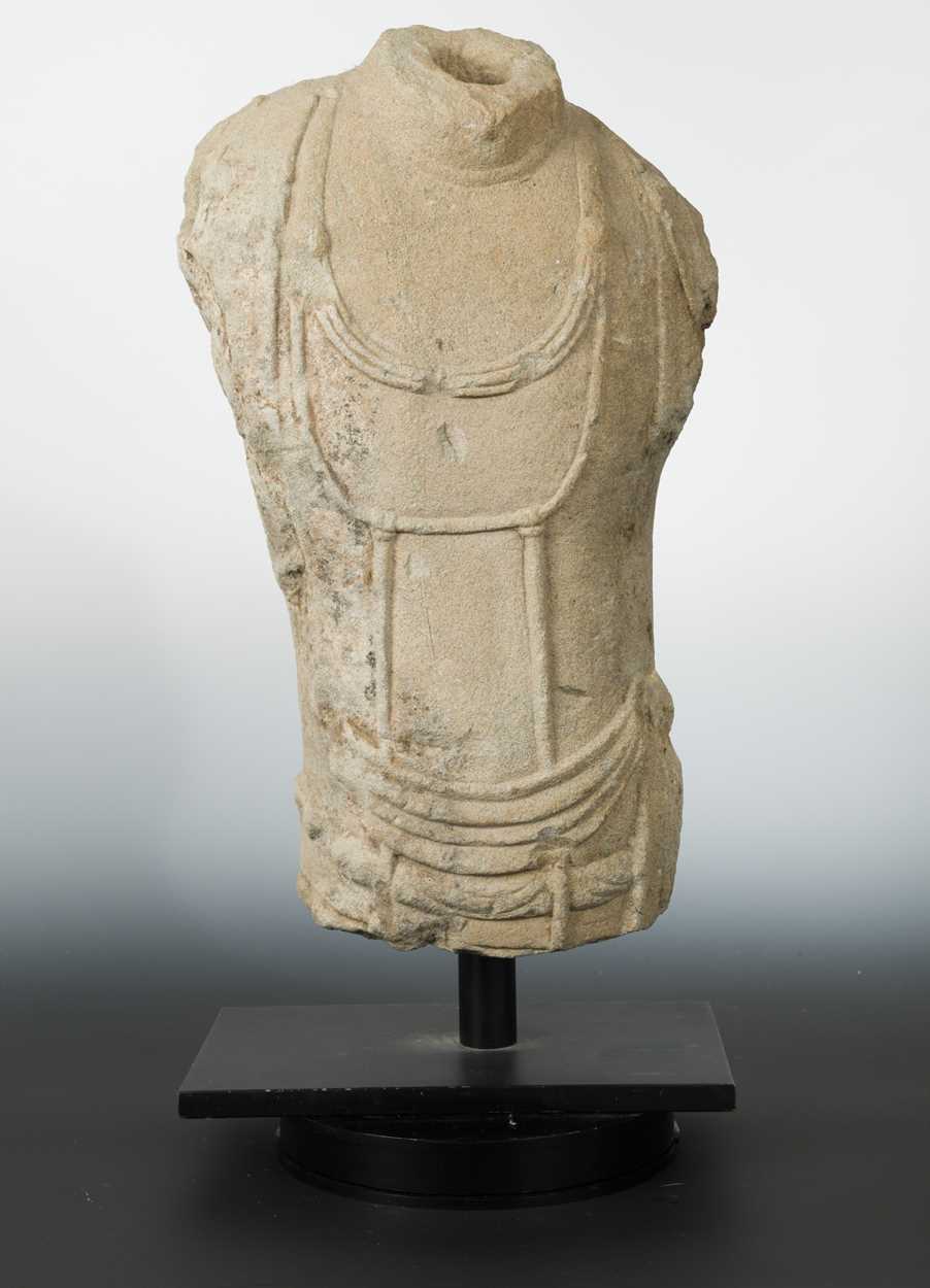 Lot 159 - A Chinese sandstone torso of Avalokiteshvara,