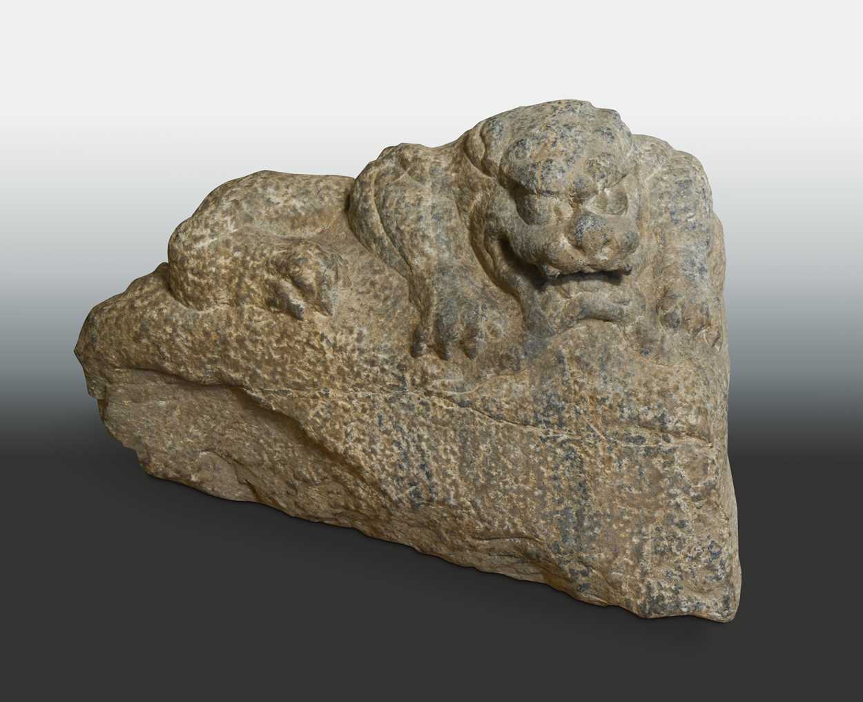 Lot 185 - A Chinese stone recumbent Fo dog, possibly
