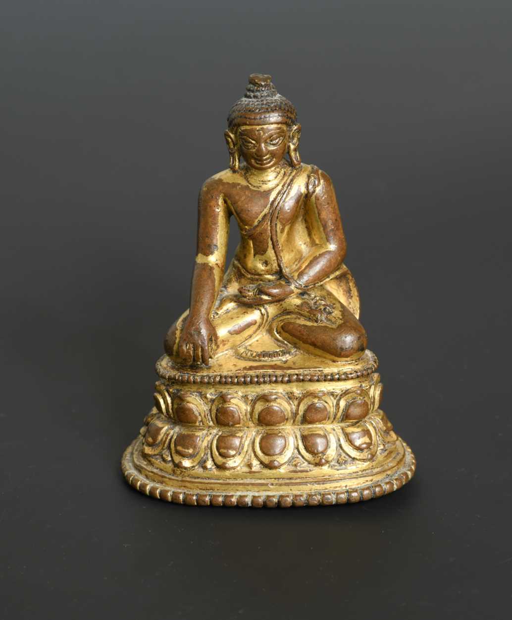 Lot 373 - A Khassamalla type gilt copper Buddha,
