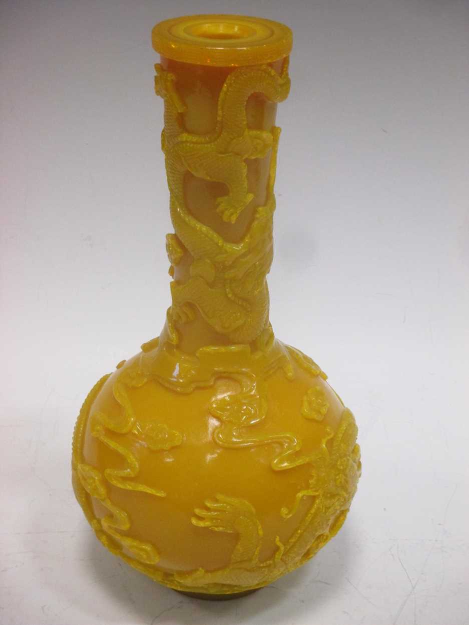 Lot 123 - A Chinese yellow Peking Glass dragon bottle