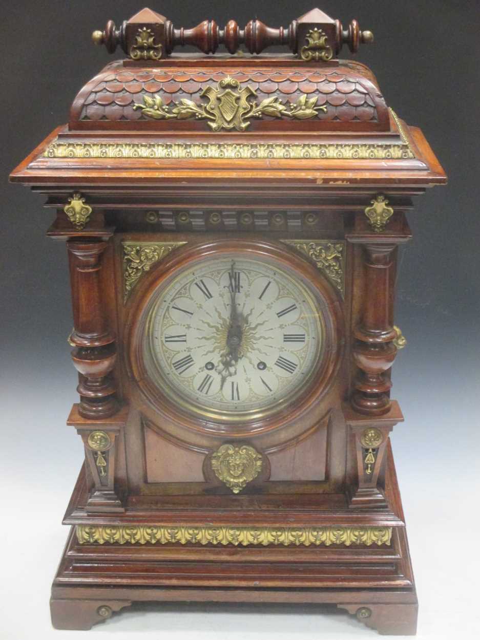 Lot 135 - A walnut mantel clock, 70cm high