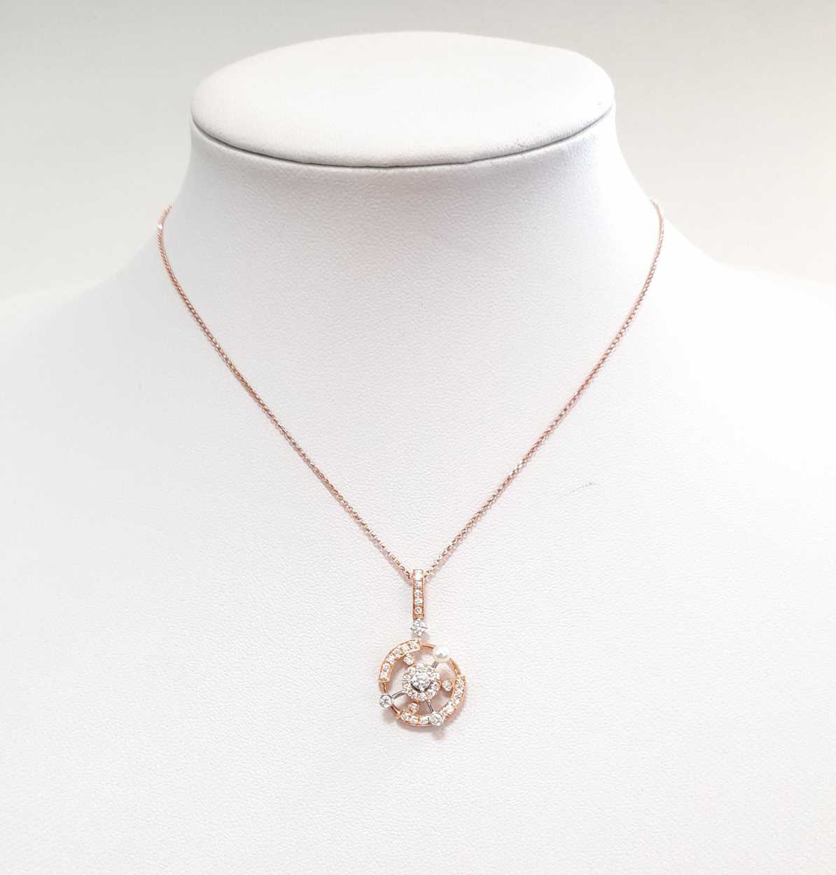 Lot 158 - A diamond and pearl set 'petit tourbillon'