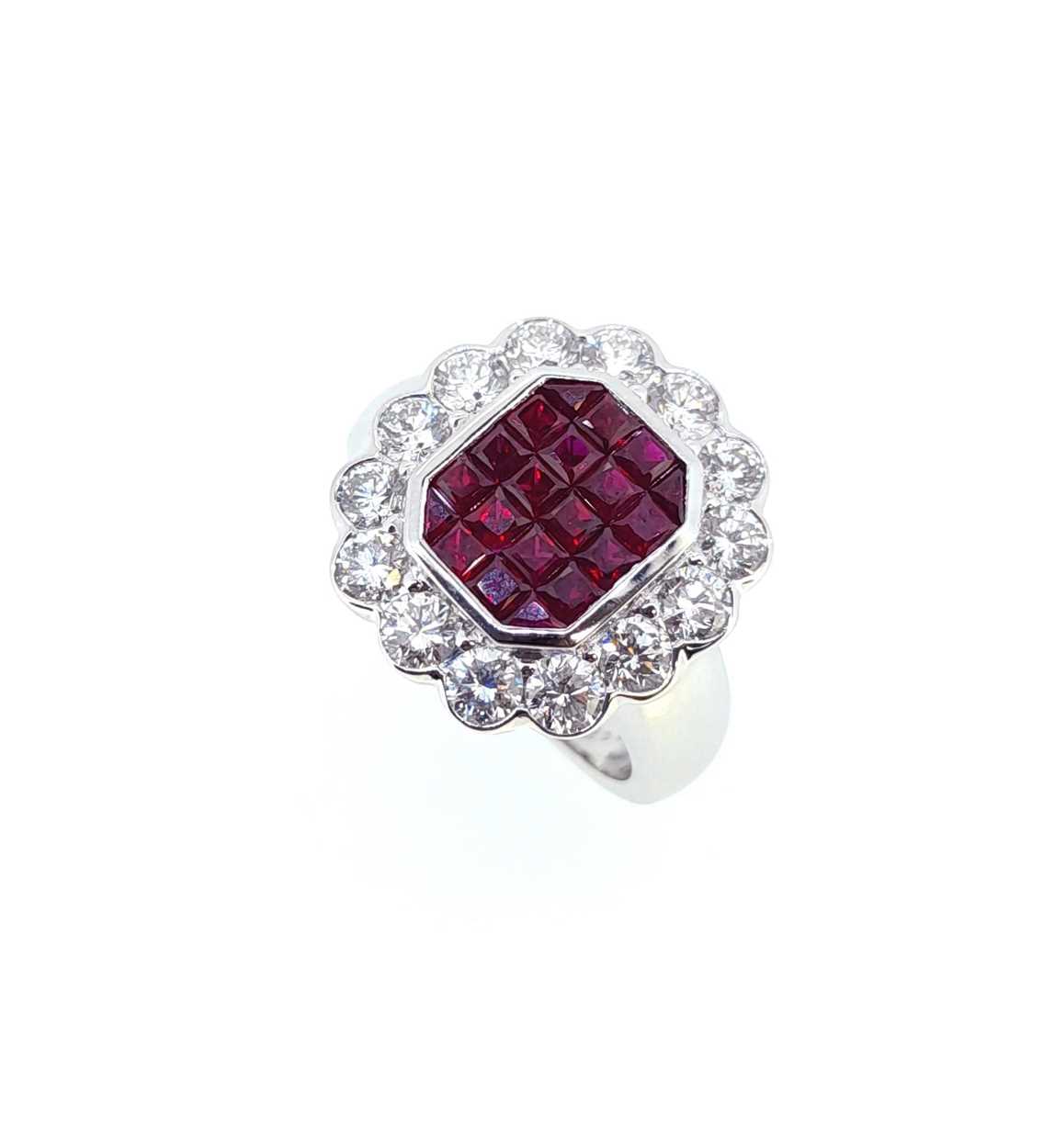 Lot 147 - An invisible set ruby and diamond