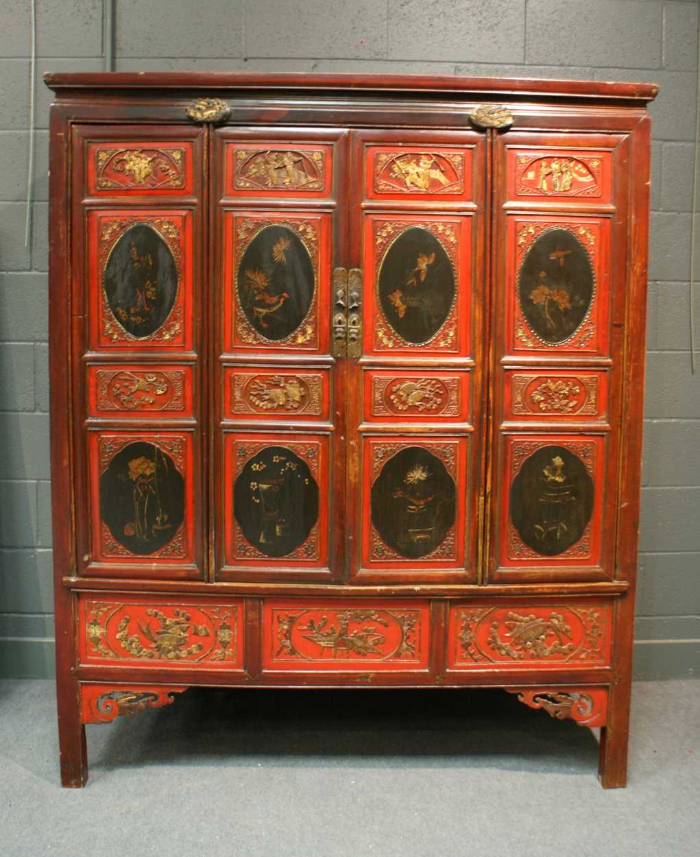 Lot 434 - A large red laquer Chinese cabinet, 185 x