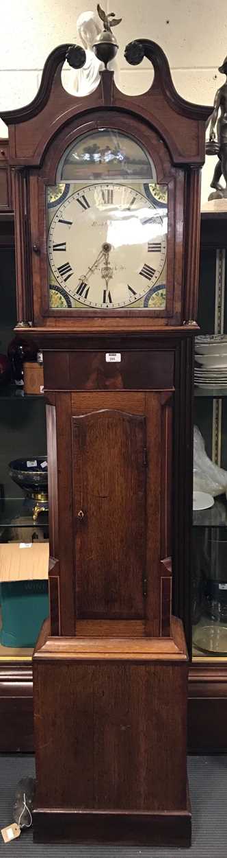 Lot 355 - A provincial oak and walnut longcase clock,