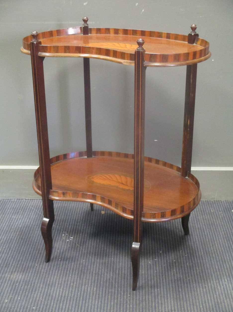 Lot 559 - An inlaid mahogany two tier kidney shape