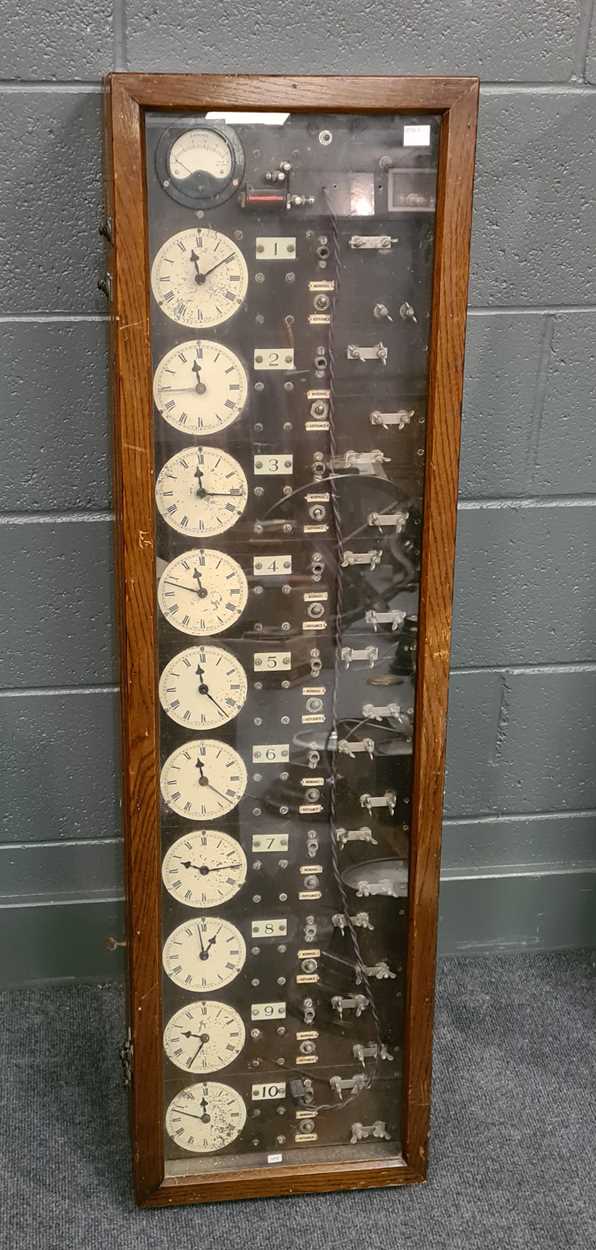 Lot 234 - Synchronome 10 dial distribution panel, oak
