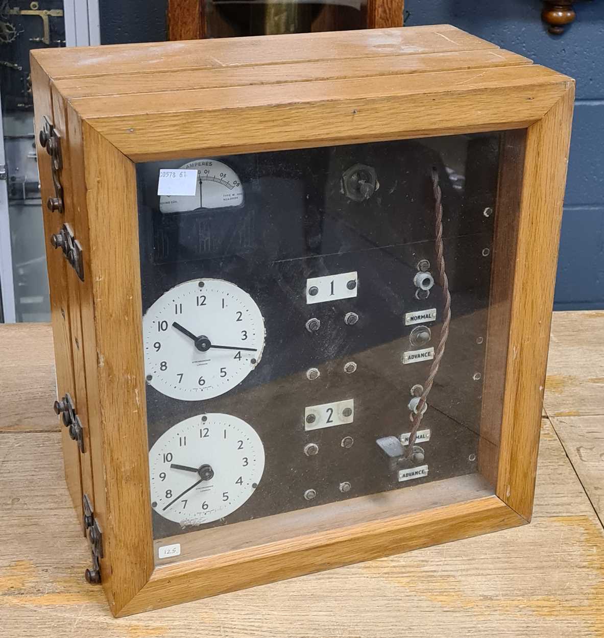 Lot 289 - Synchronome two dial distributon panel,