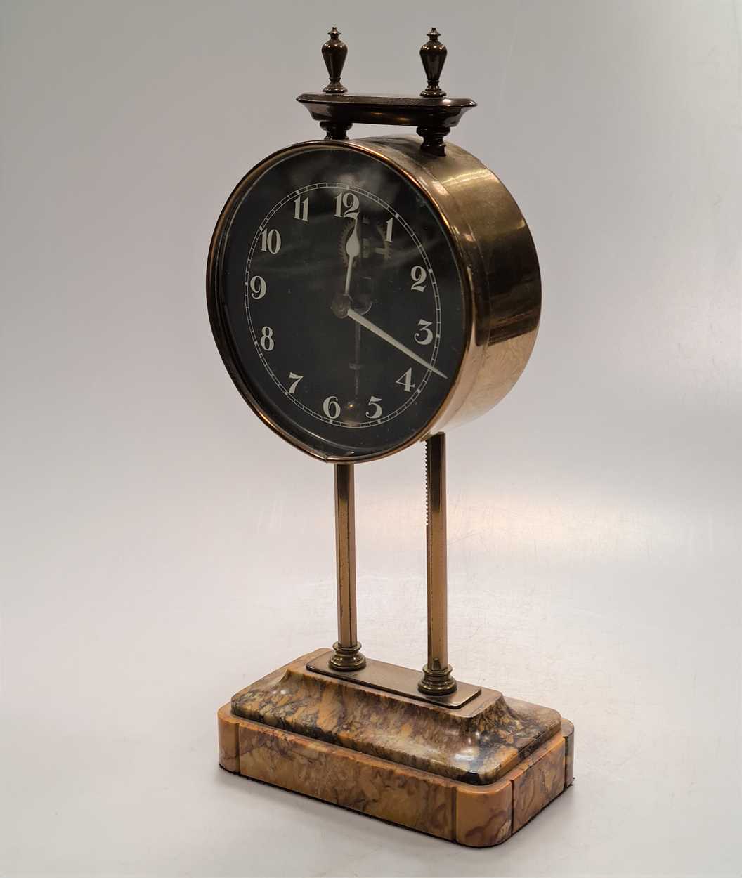 Lot 319 - A British made gravity clock with 10cm dial,