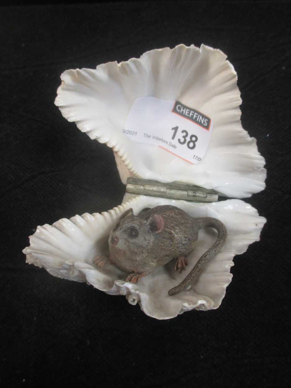Lot 138 - A cold painted model of a rat in shell, 9cm