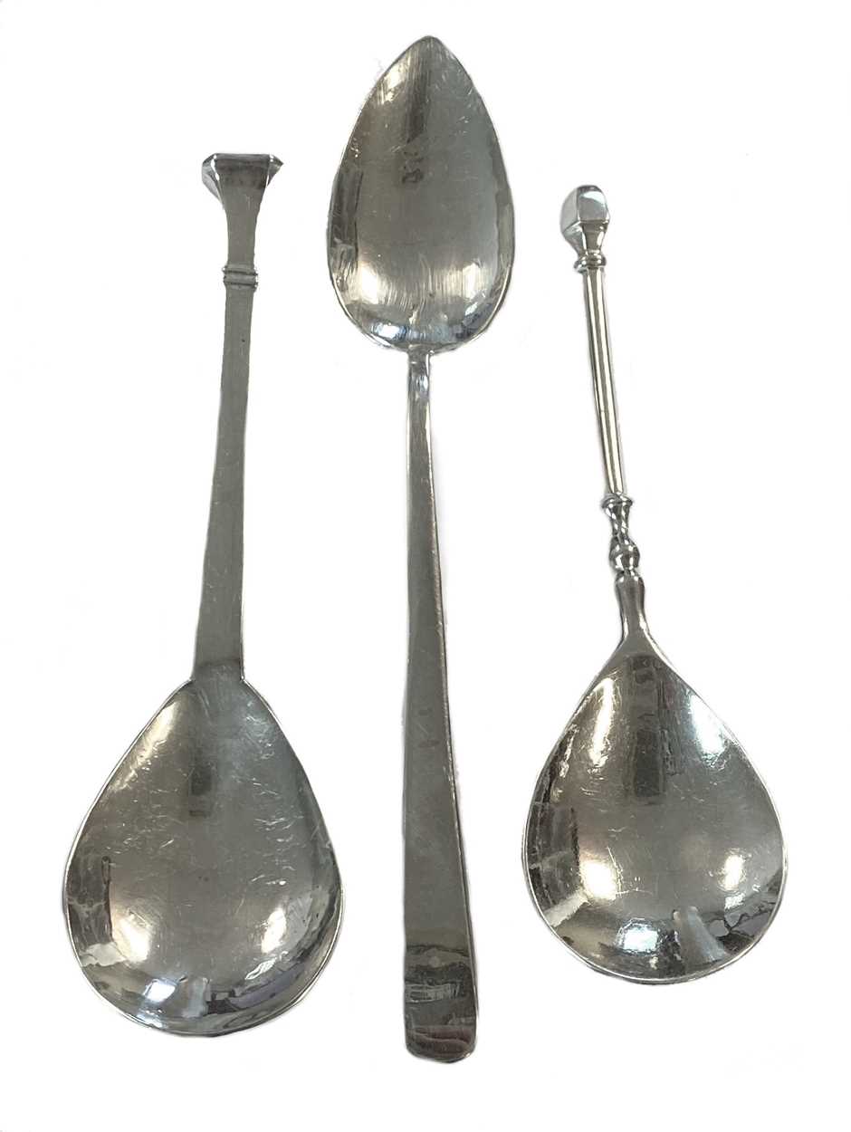 Lot 321 - Three 20th century silver conserve spoons,