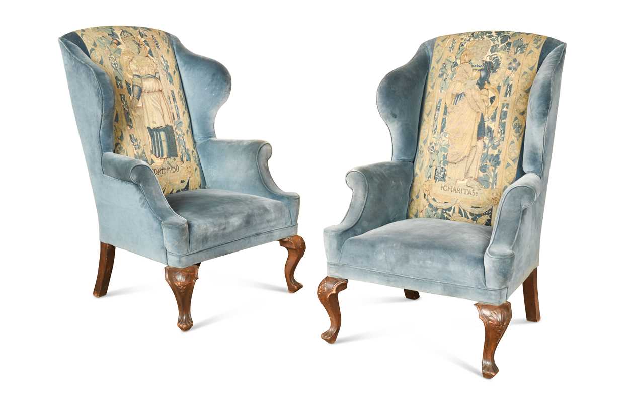 Lot 248 - A pair of George II style wing arm chairs,