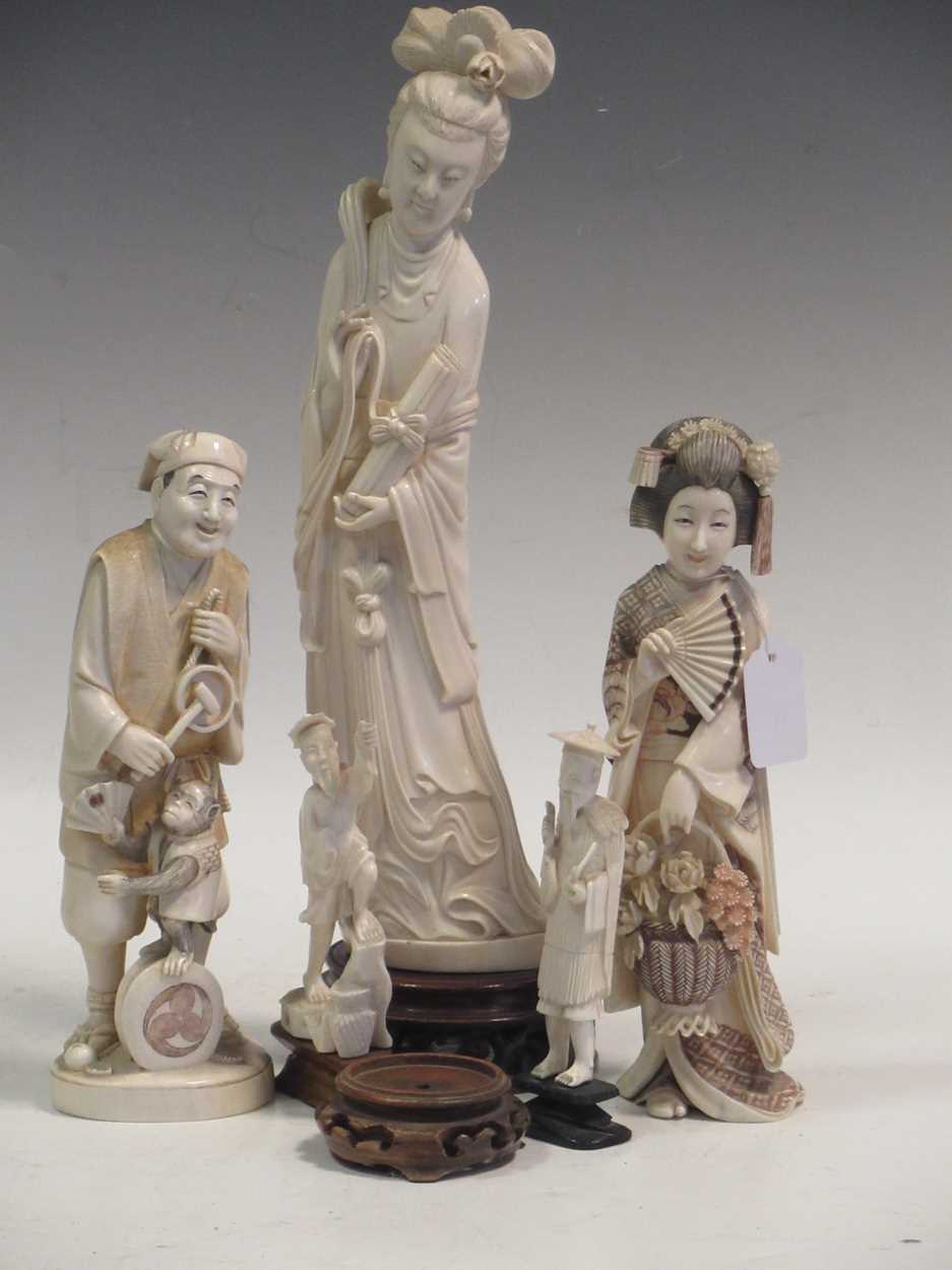 Lot 33 - A collection of five ivory statues.