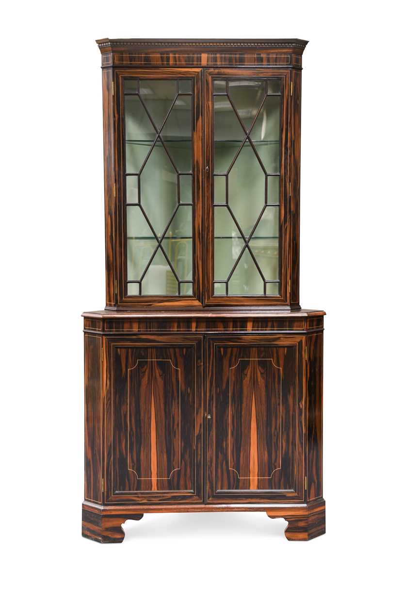 Lot 396 - A calamander corner cabinet, 20th century,