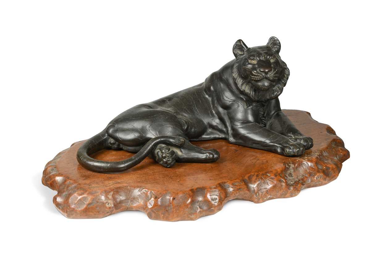 Lot 85 - A Japanese bronze of a reclining tiger,