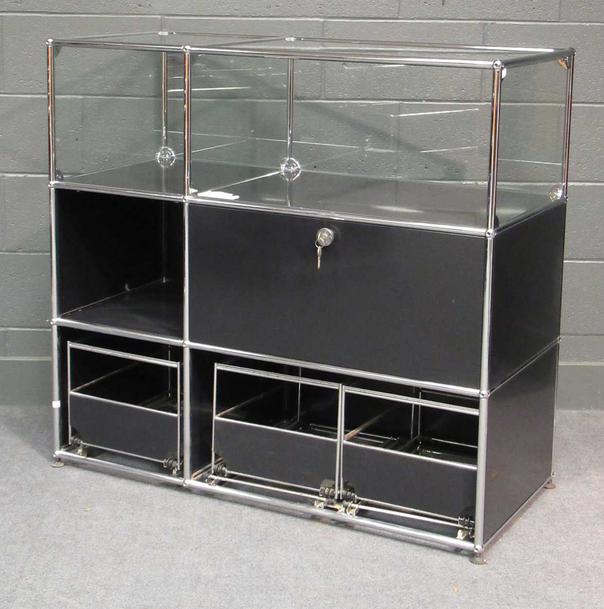 Lot 692 - A USM Haller black metal, glass and tubular