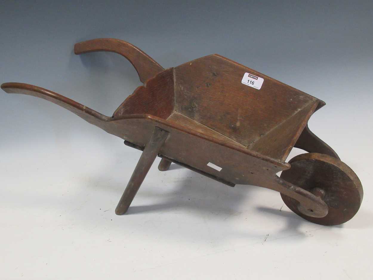 Lot 116 - A miniature oak wheelbarrow, early 20th