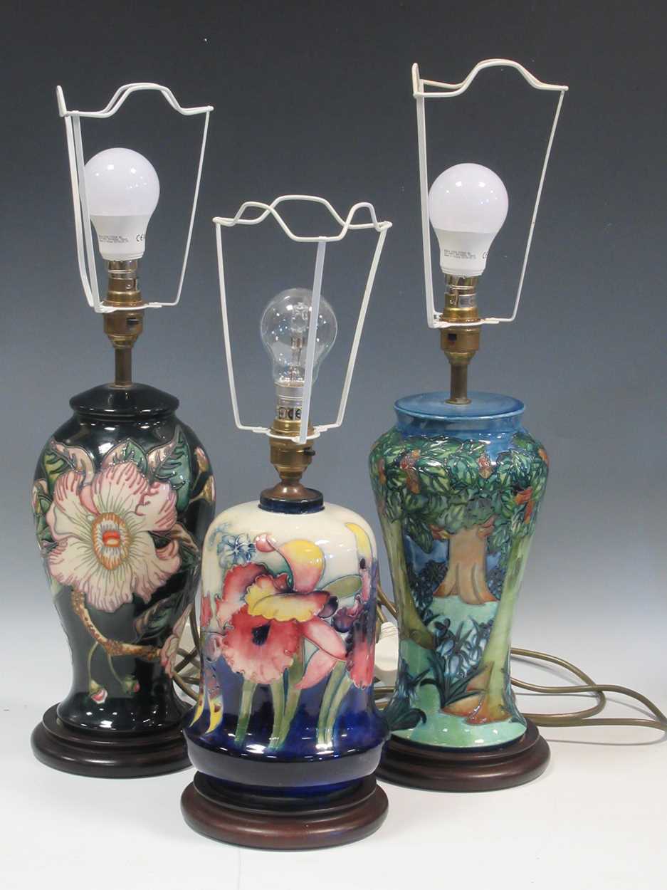 Lot 35 - A Moorcroft Orchid pattern table lamp and two