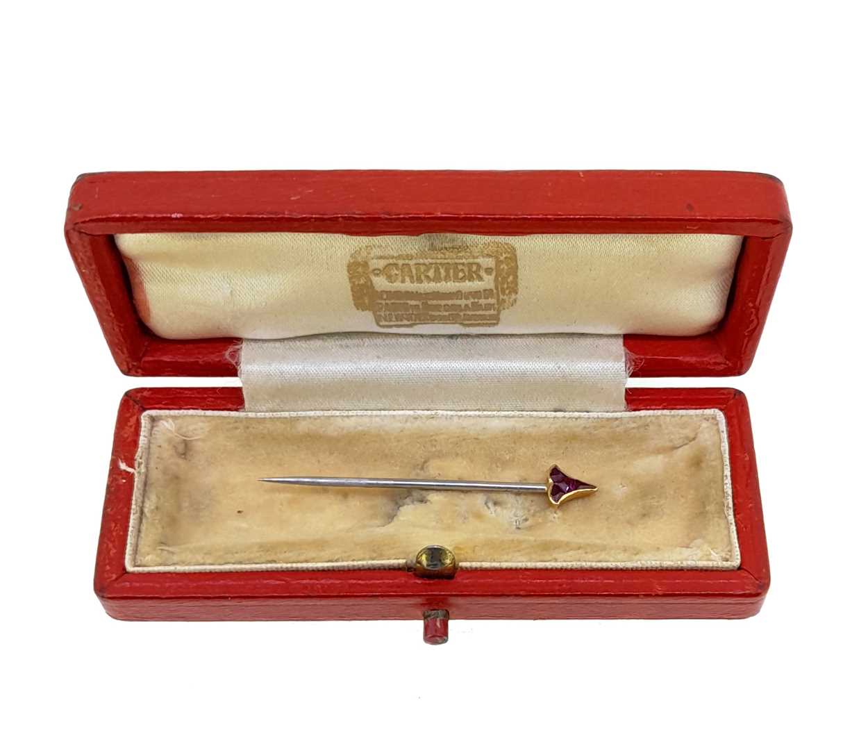 Lot 160 - Cartier - A ruby pin,