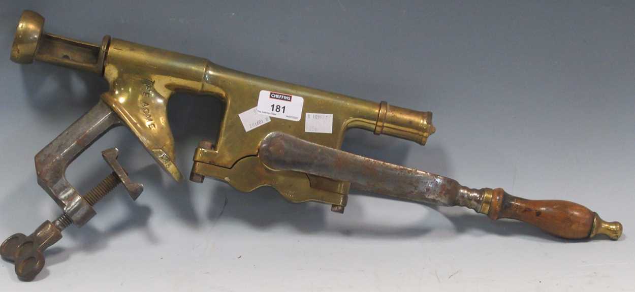 Lot 181 - Brass table mounted corkscrew