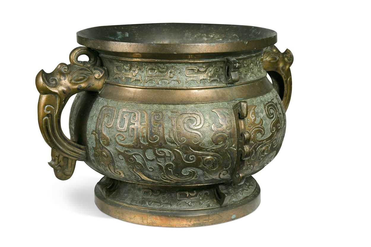 Lot 81 - A Chinese inlaid bronze two-handled Gui
