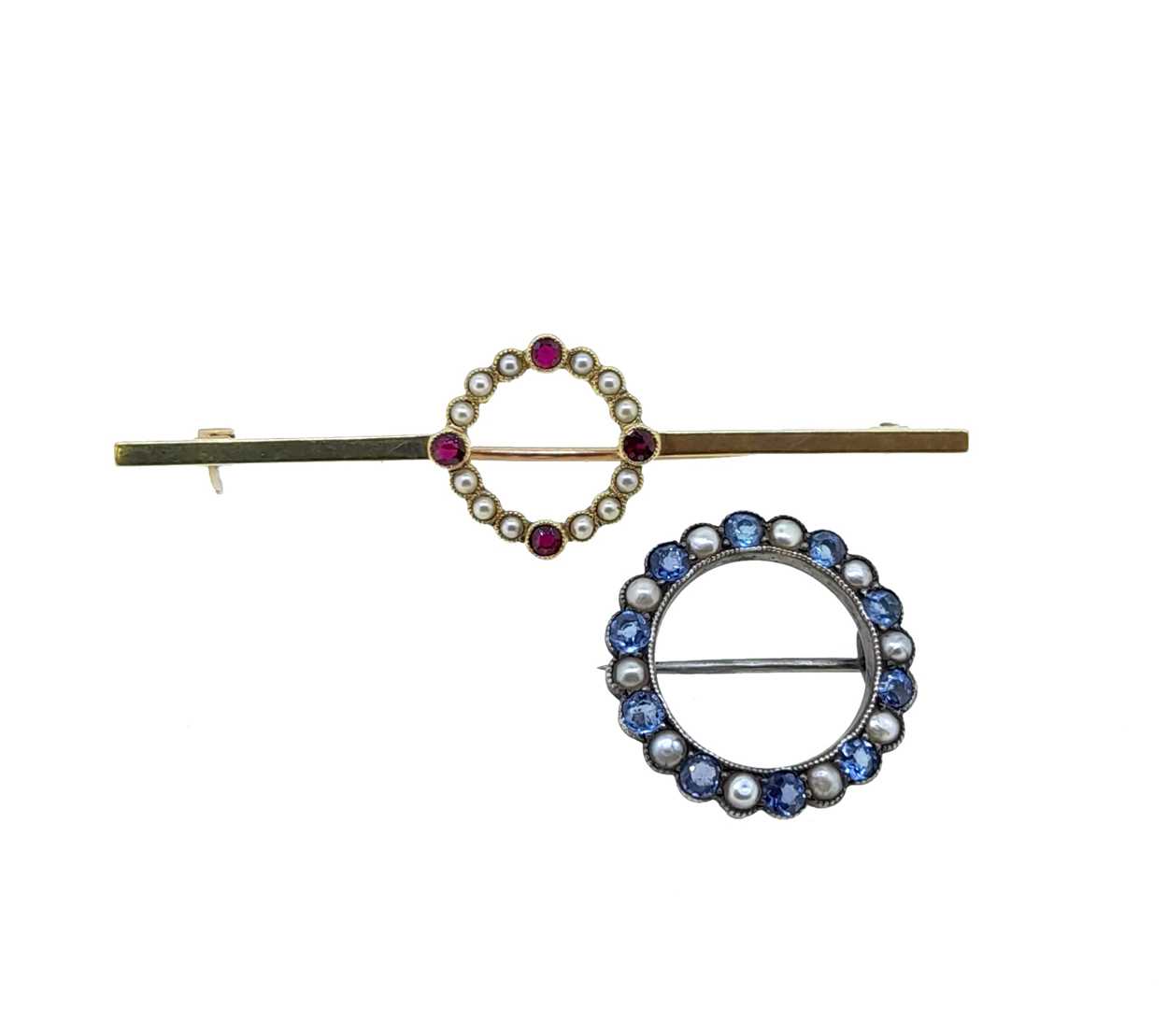 Lot 52 - Two circular brooches,