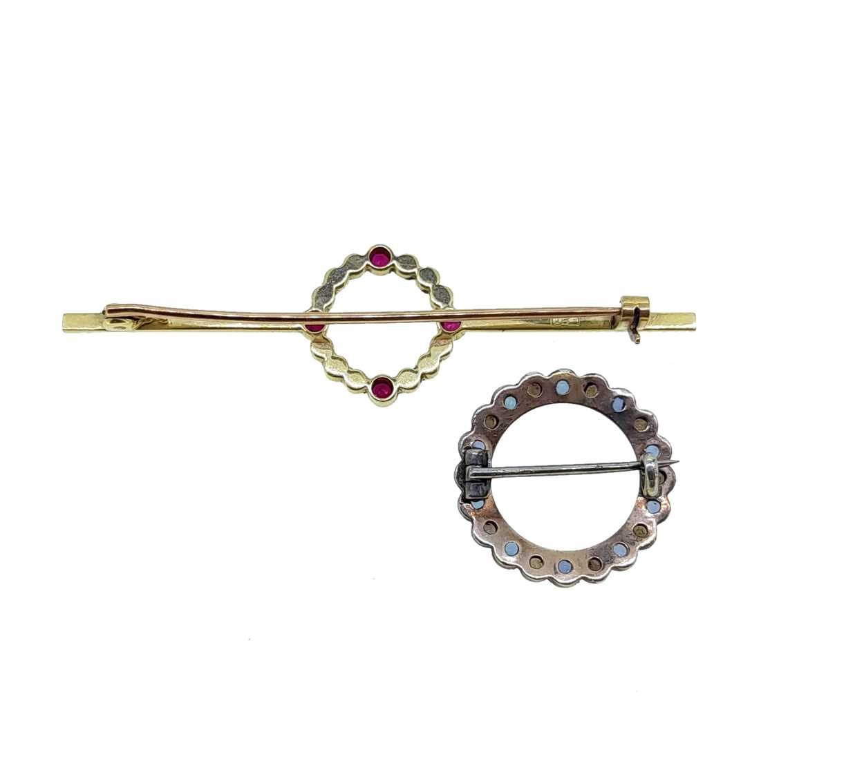 Lot 52 - Two circular brooches,