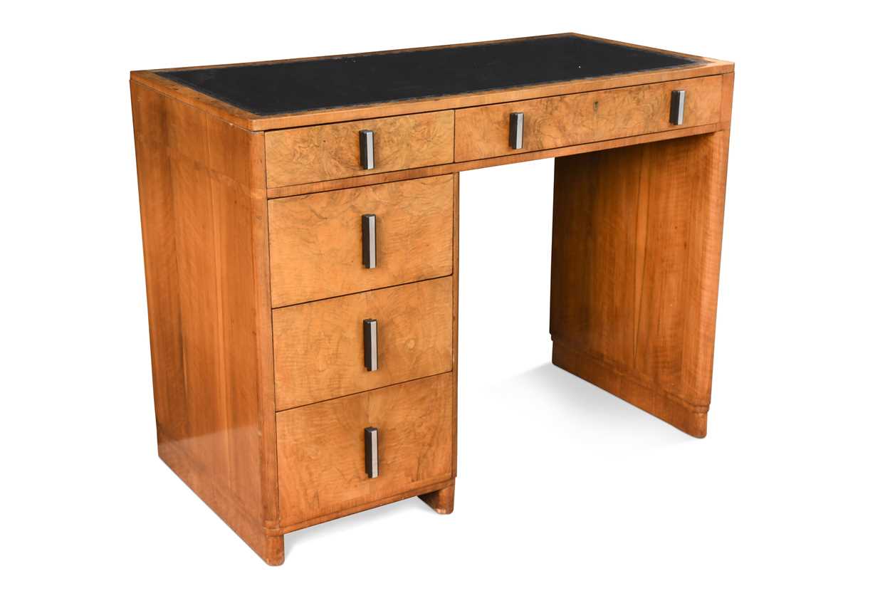 Lot 180 - An Art Deco leather inset walnut desk,