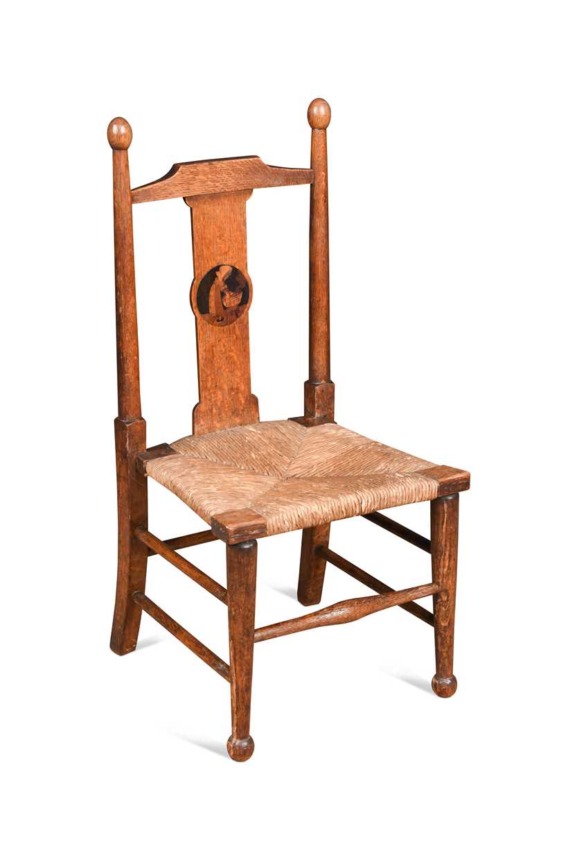 Lot 145 - An Arts and Crafts oak 'nursery-rhyme' chair
