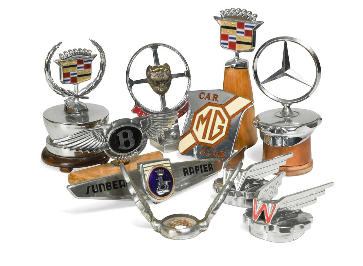 Lot 125 - A group of ten car emblems,