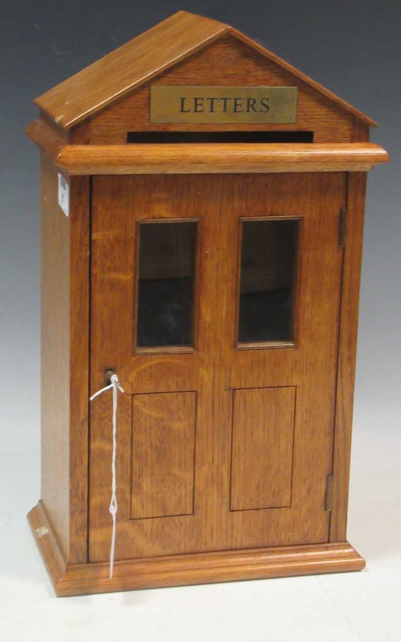 Lot 87 - An oak letter box modelled as a door front 38.