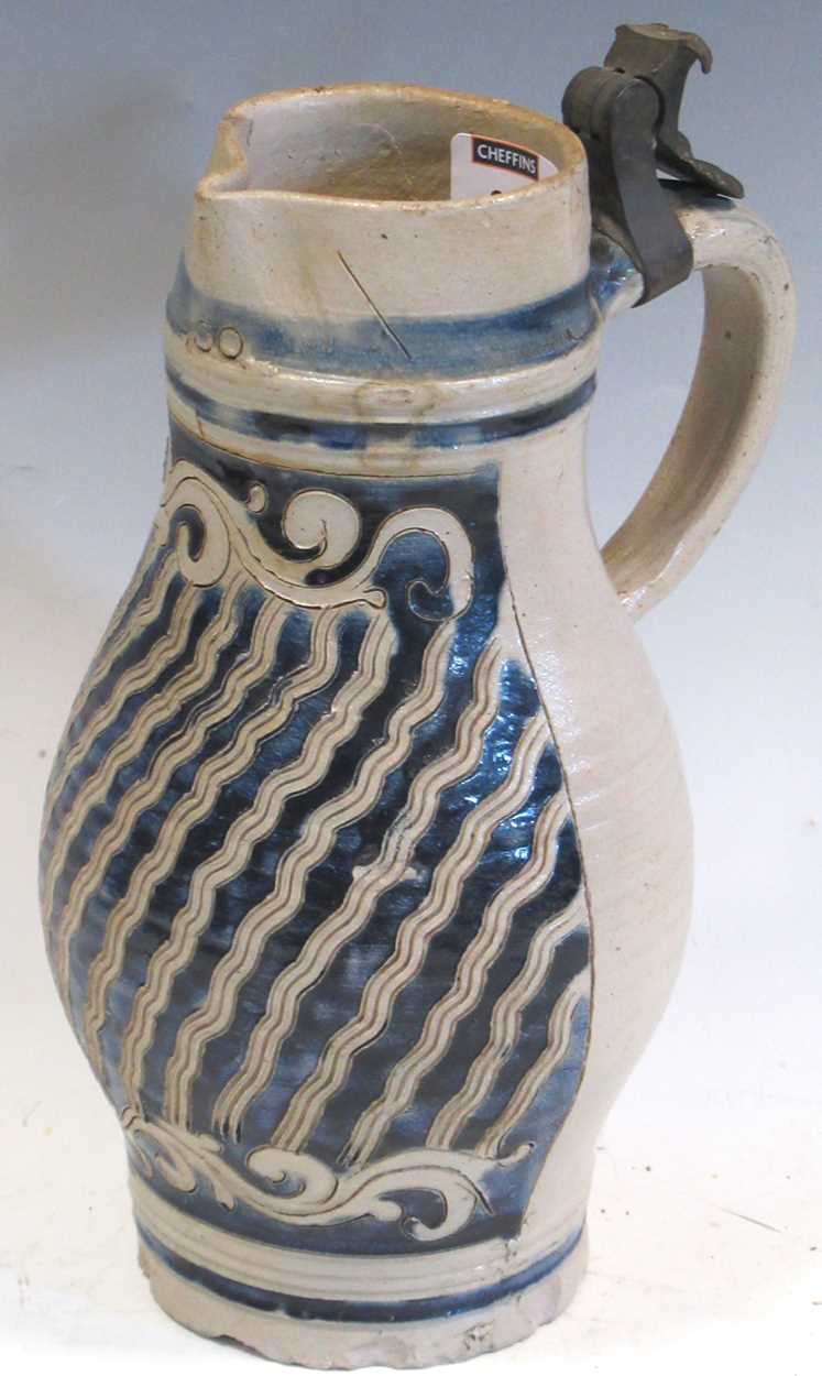 Lot 93 - An 18th-century Westerwald jug, the body with