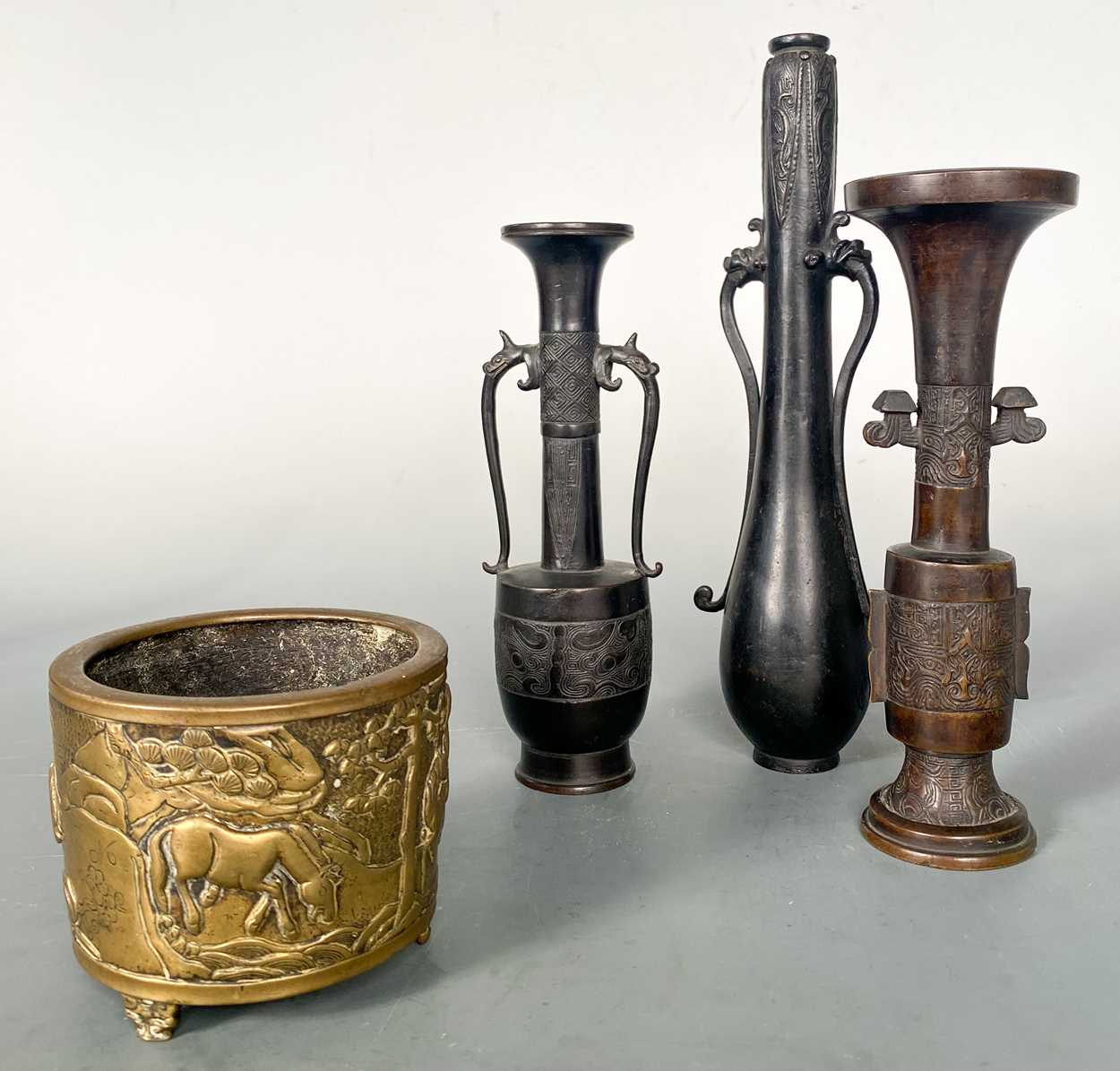Lot 46 - Three Chinese bronze small cylinder vases in