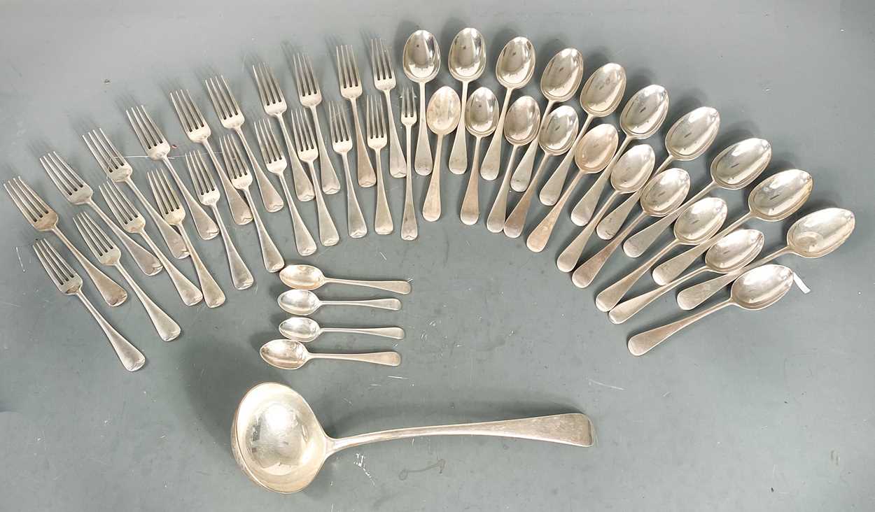 Lot 555 - A 49-piece set of George V silver flatware,